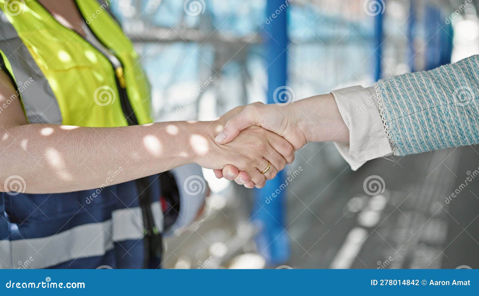 Two Women Architect and Worker Shake Hands Working at Street Stock ...