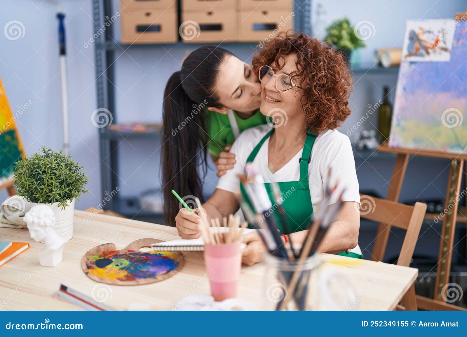 Two Women Artists Drawing on Notebook Kissing at Art Studio Stock Image ...