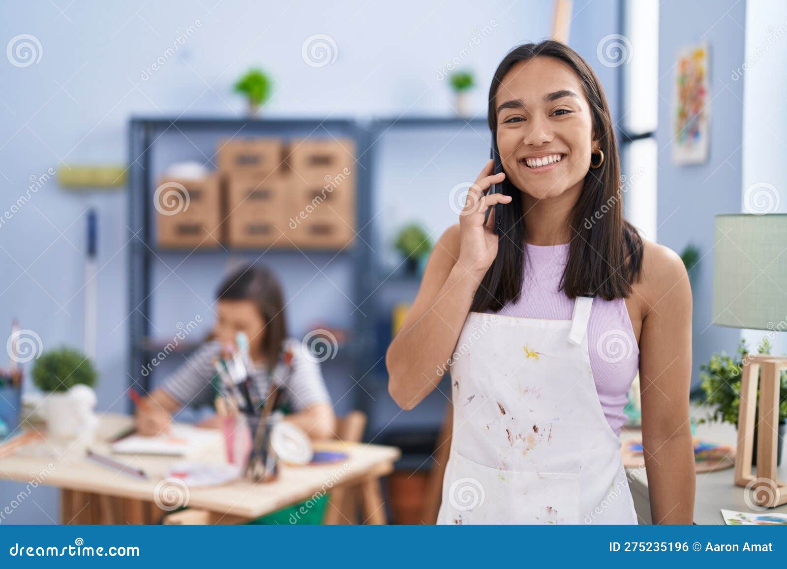 Two Women Artists Drawing on Notebook Talking on Smartphone at Art ...