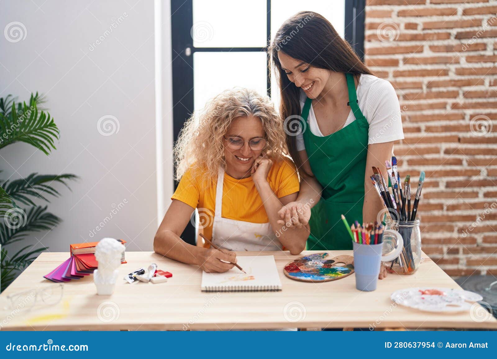 Two Women Artists Smiling Confident Drawing on Notebook at Art Studio ...