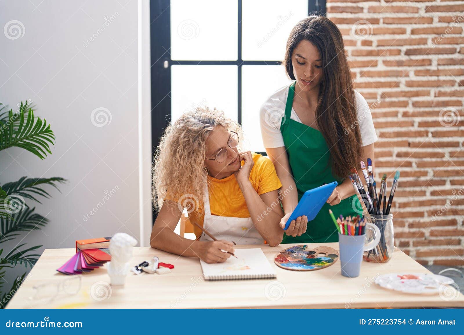 Two Women Artists Using Touchpad Drawing at Art Studio Stock Photo ...