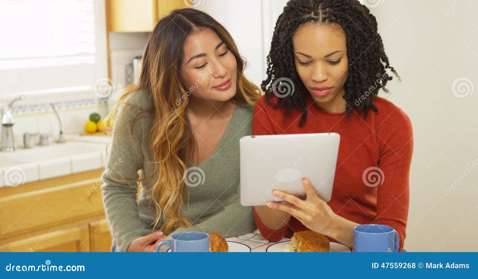 Two Women Best Friends Eating Breakfast and Using Tablet Computer Stock ...