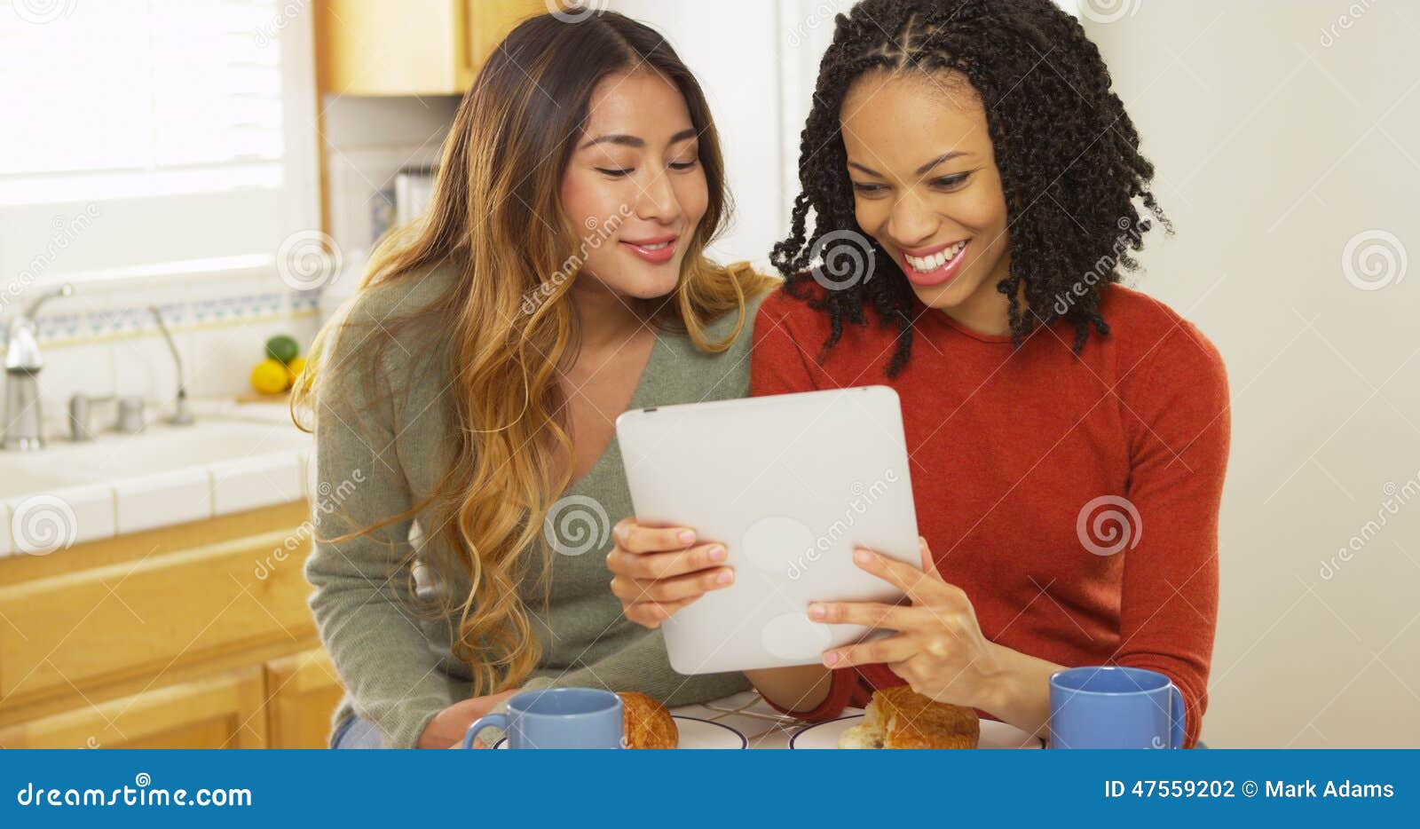 Two Women Best Friends Eating Breakfast and Using Tablet Computer Stock ...