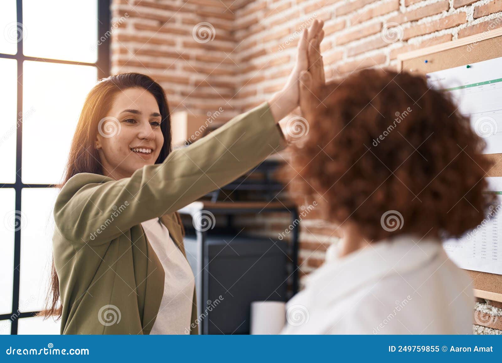Two Women Business Workers High Five with Hands Raised Up at Office ...
