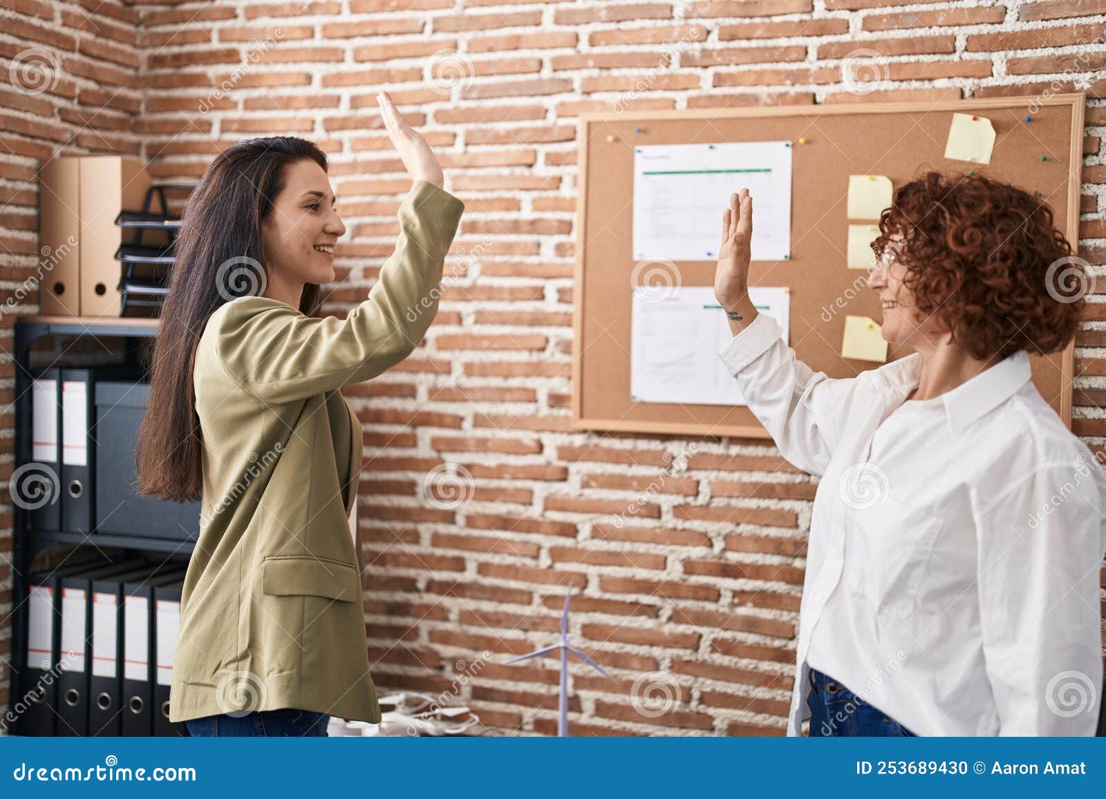 Two Women Business Workers High Five with Hands Raised Up at Office ...