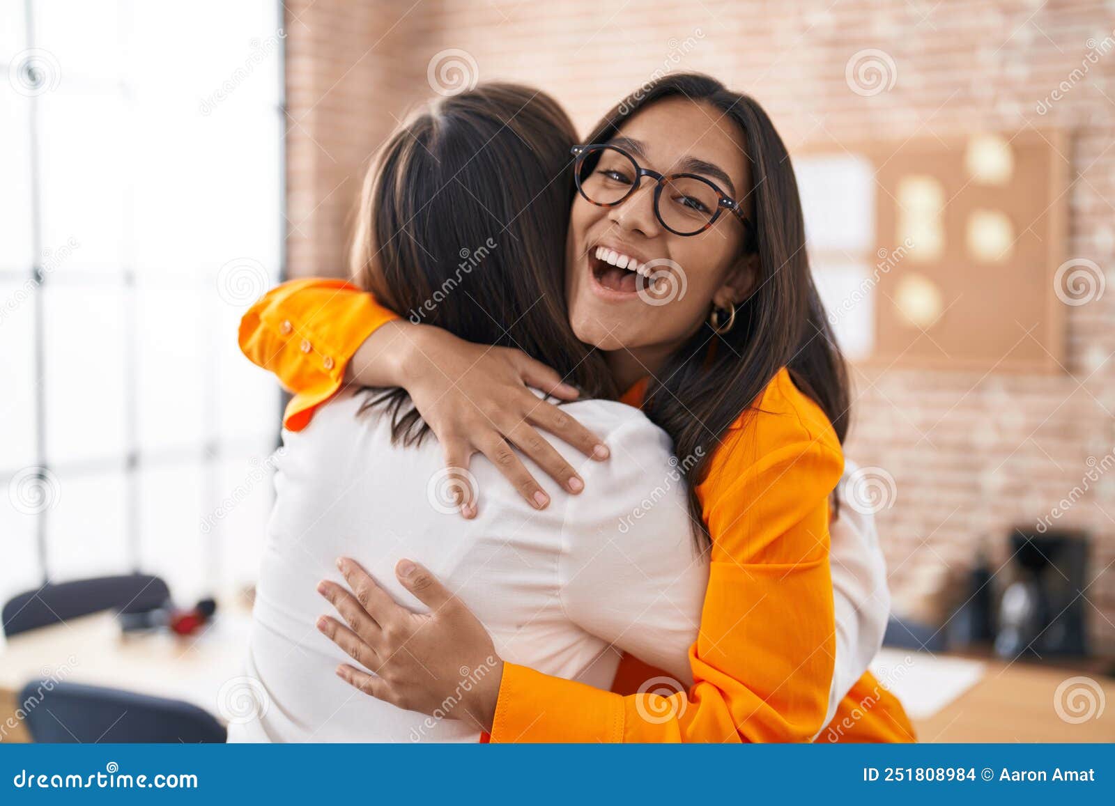 Two Women Business Workers Hugging Each Other at Office Stock Photo ...