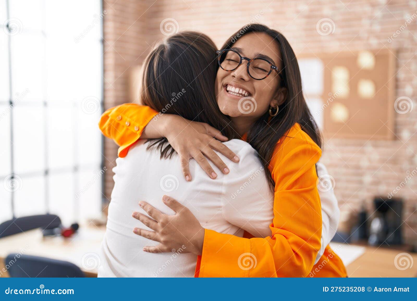 Two Women Business Workers Hugging Each Other at Office Stock Photo ...