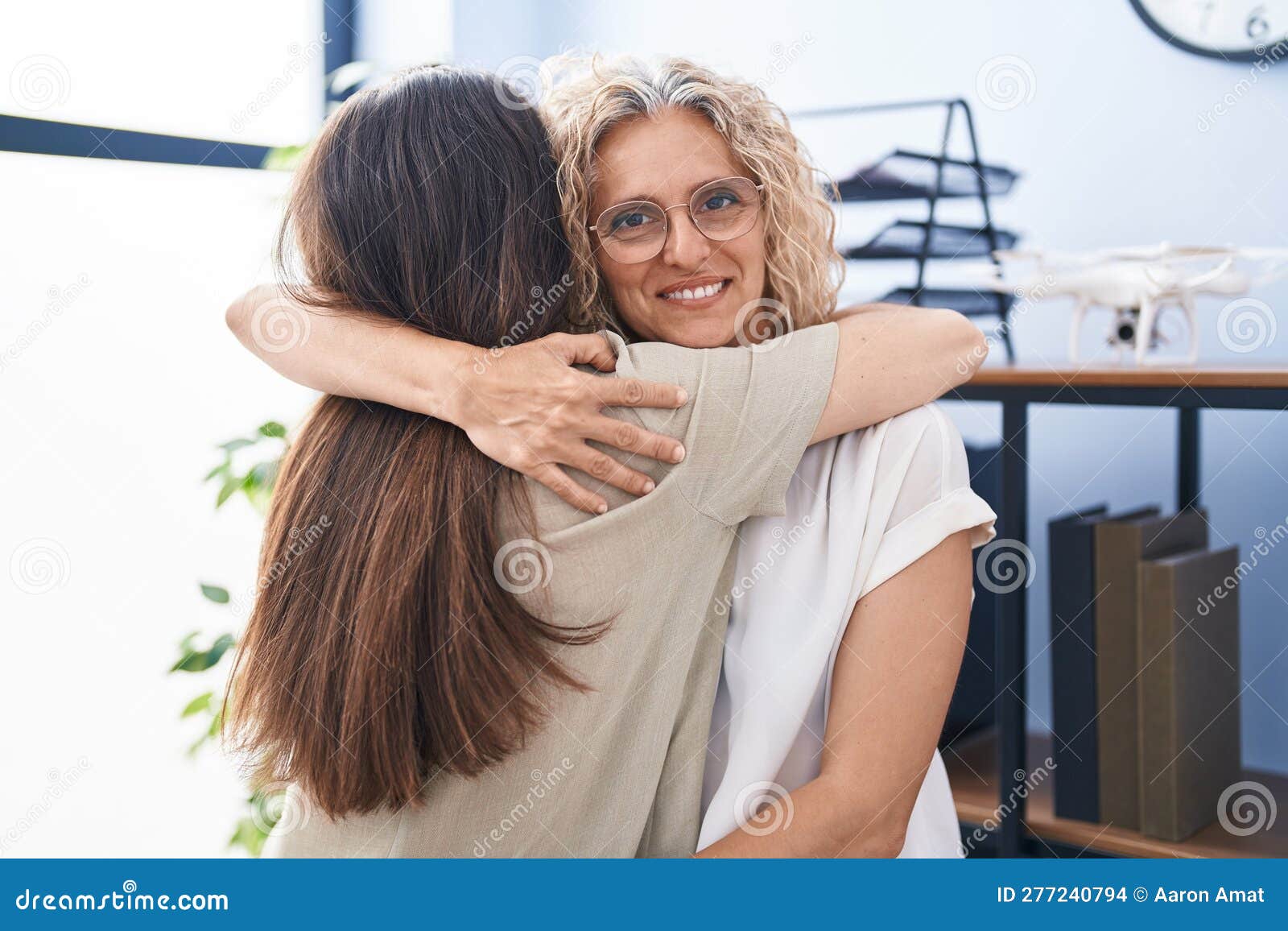 Two Women Business Workers Hugging Each Other at Office Stock Photo ...
