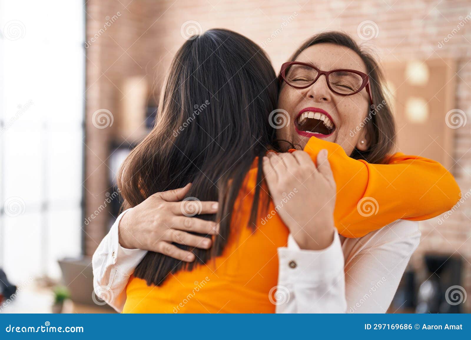 Two Women Business Workers Hugging Each Other at Office Stock Photo ...