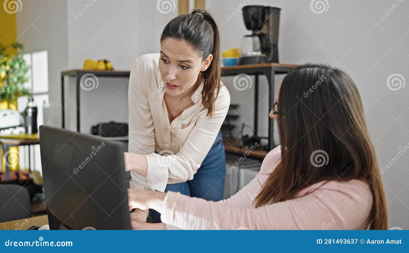 Two Women Business Workers Using Computer Speaking at Office Stock ...