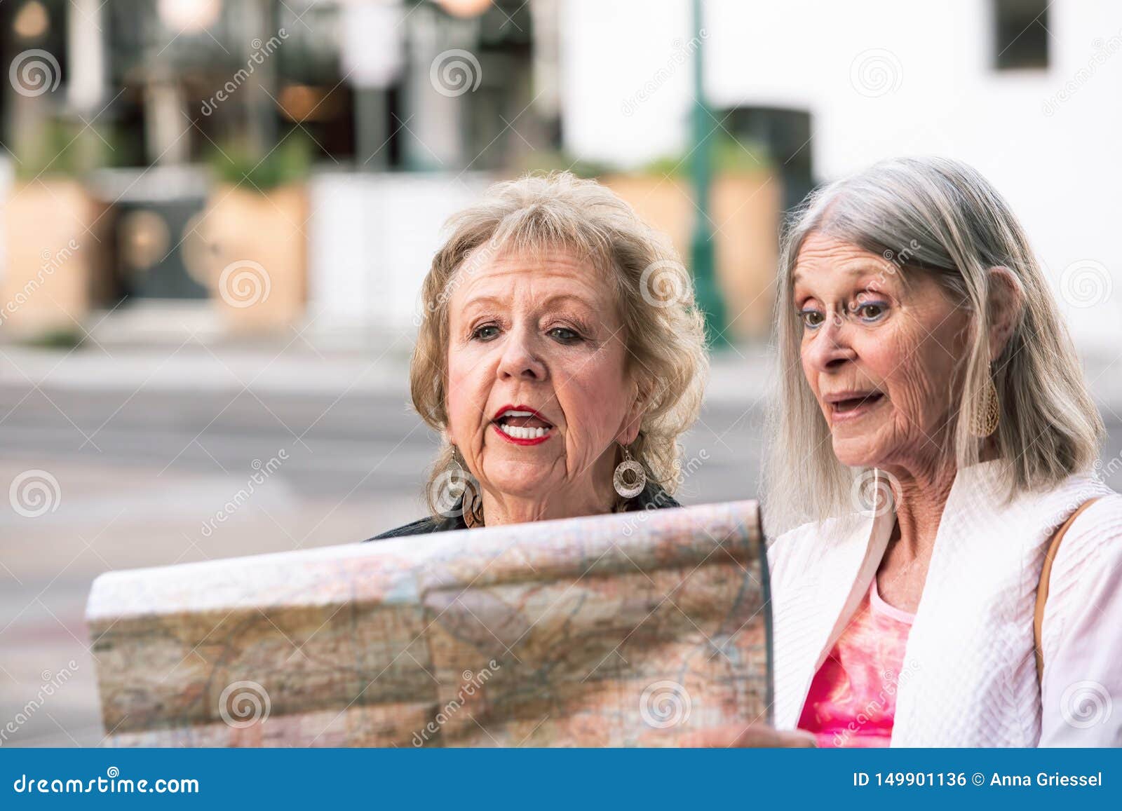 Two Women Checking a Map stock photo. Image of searching - 149901136