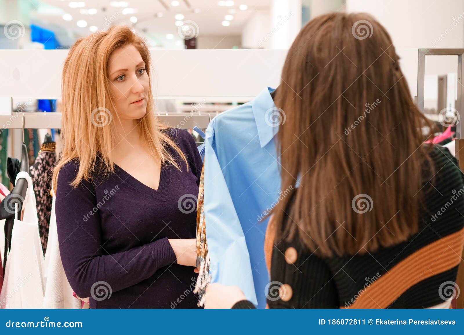 Two Women Choose Clothes in a Store Stock Image - Image of department ...