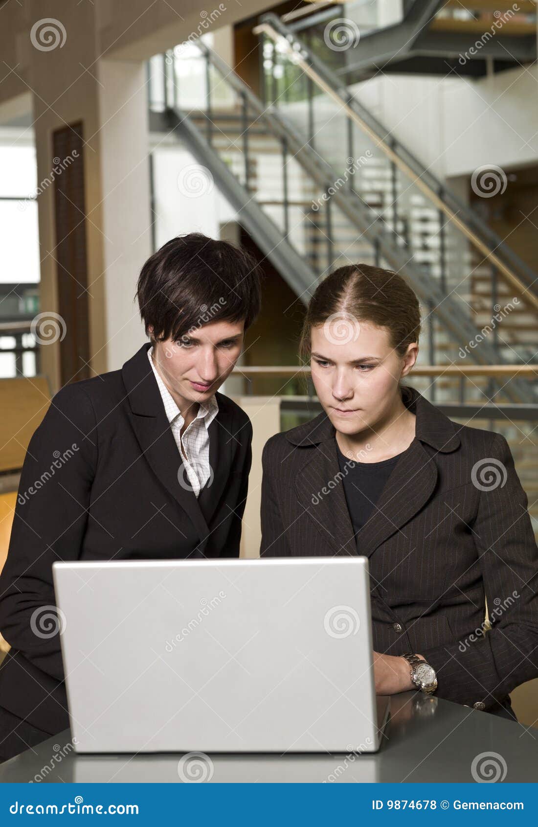 Two women and a computer stock photo. Image of modern - 9874678