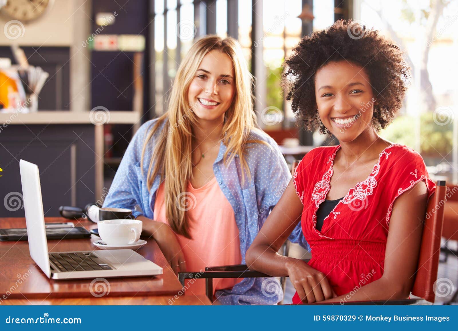 Two Women with Computer in a Coffee Shop, Portrait Stock Image - Image ...