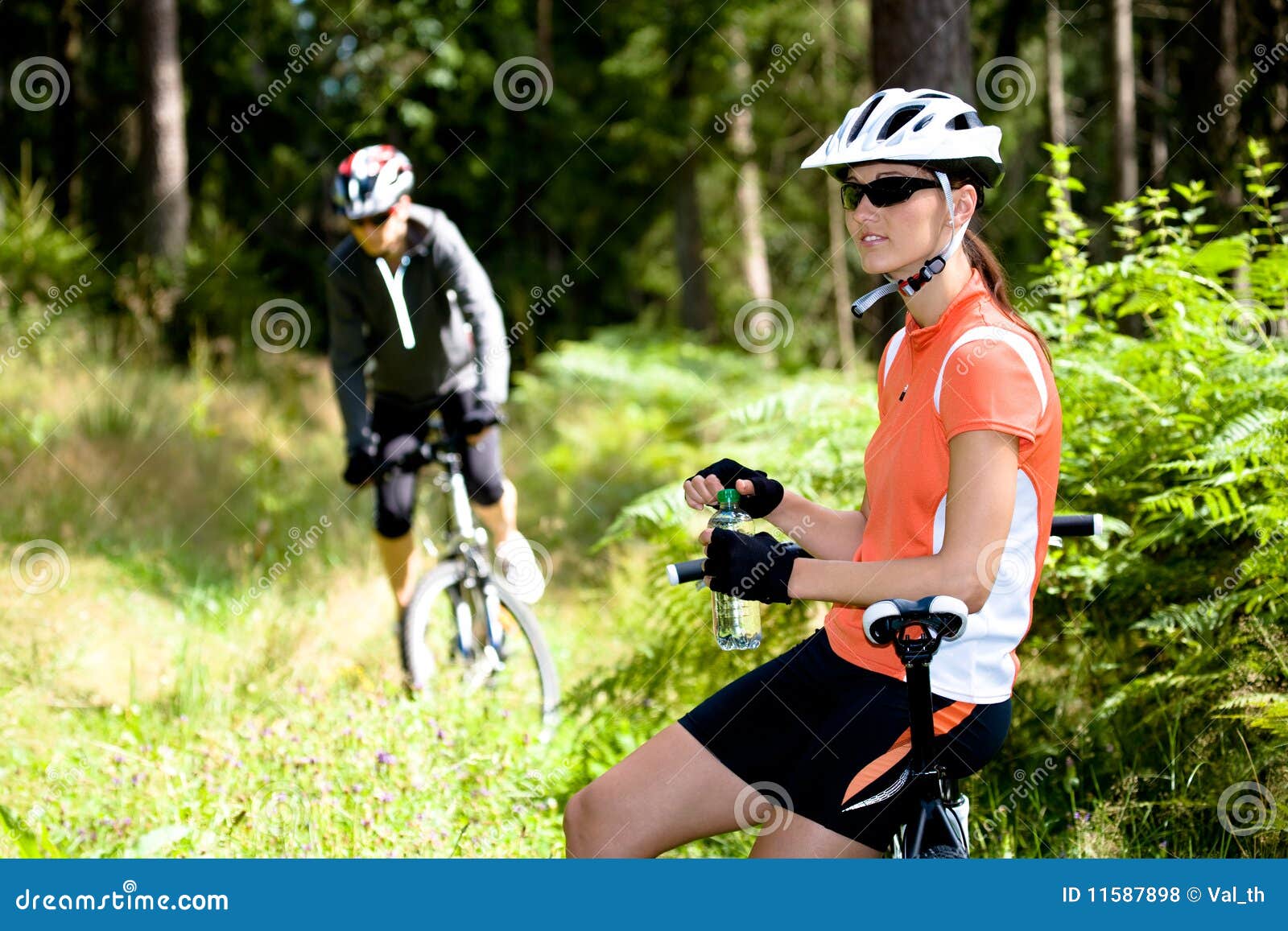 Two Women Cycling in the Forest Stock Photo - Image of female, bike ...
