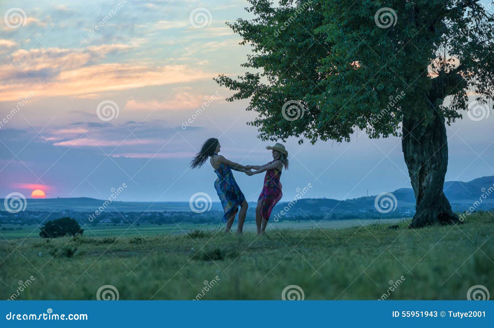 Two Women Dancing on the Grass at Sunset Stock Image - Image of pretty ...