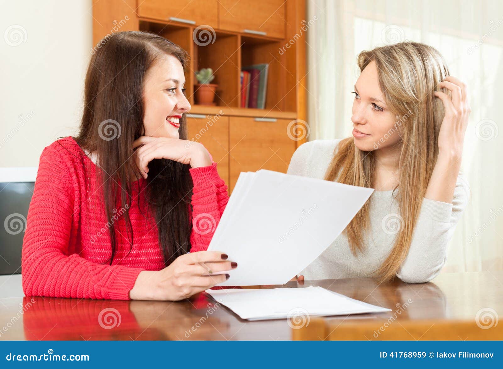 Two Women Discussing a Contract Stock Image - Image of work, reading ...