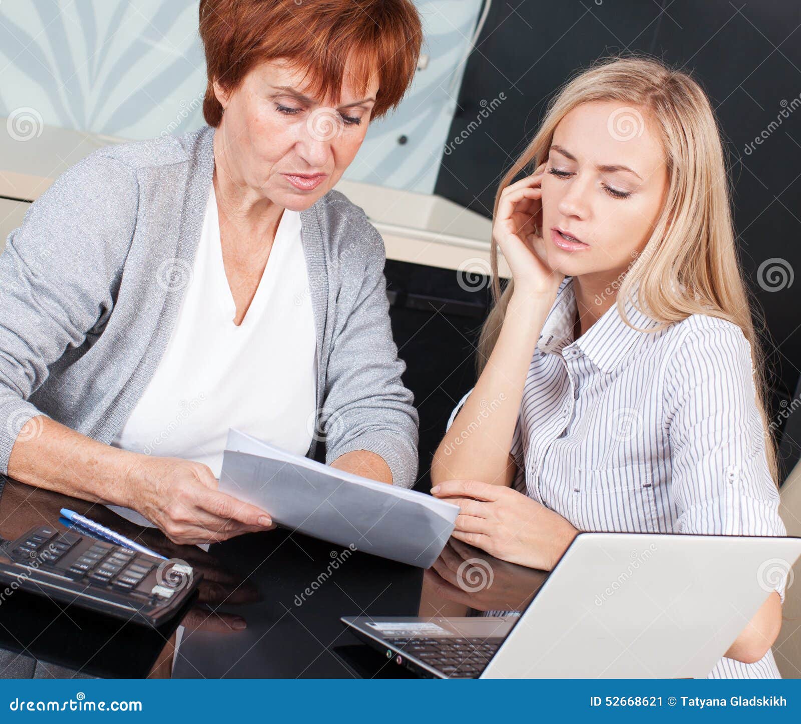 Two Women Discussing Documents at Kitchen Stock Image - Image of ...