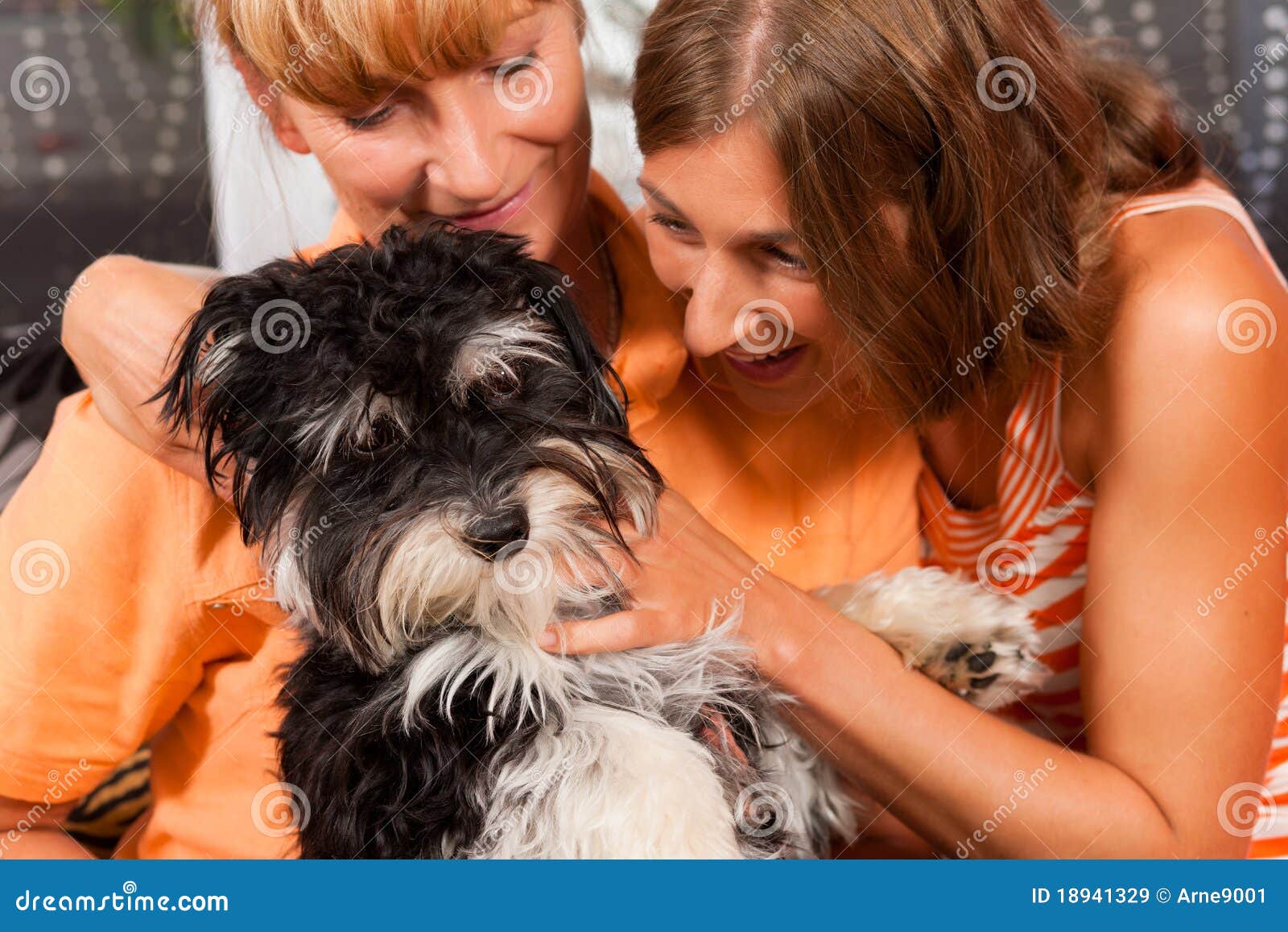 Two women with dog stock image. Image of relaxation, family - 18941329