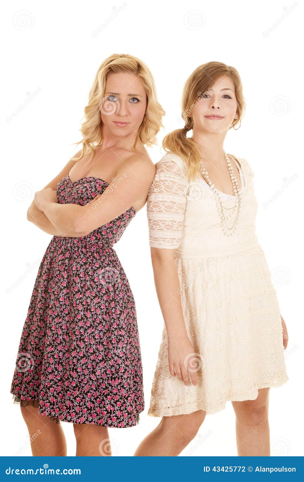Two Women in Dresses Back To Back Serious Stock Photo - Image of ...