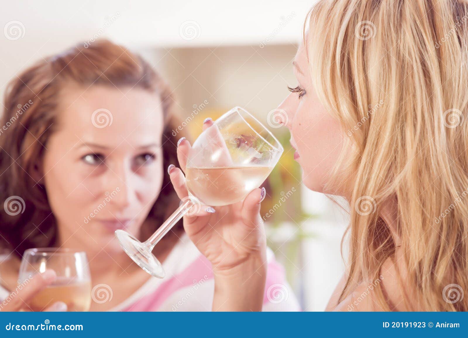 Two women drinking wine stock image. Image of chatting - 20191923