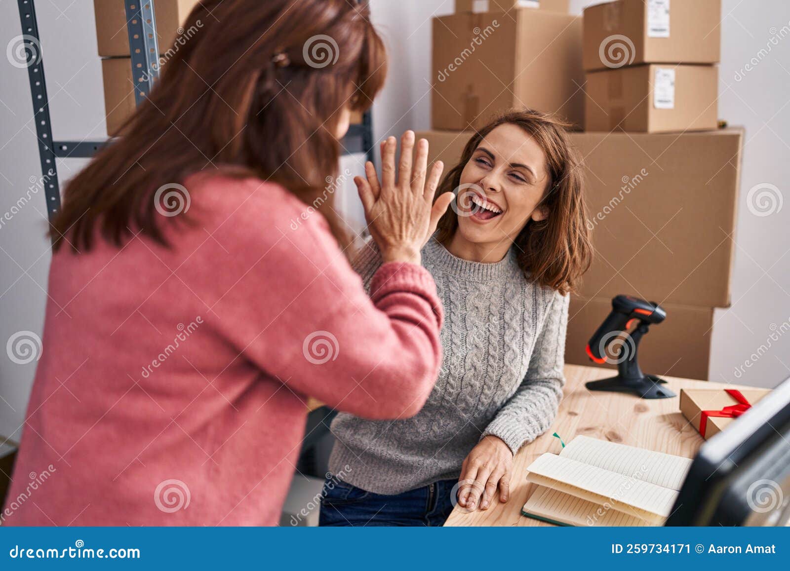 Two Women Ecommerce Business Workers High Five with Hands Raised Up at ...