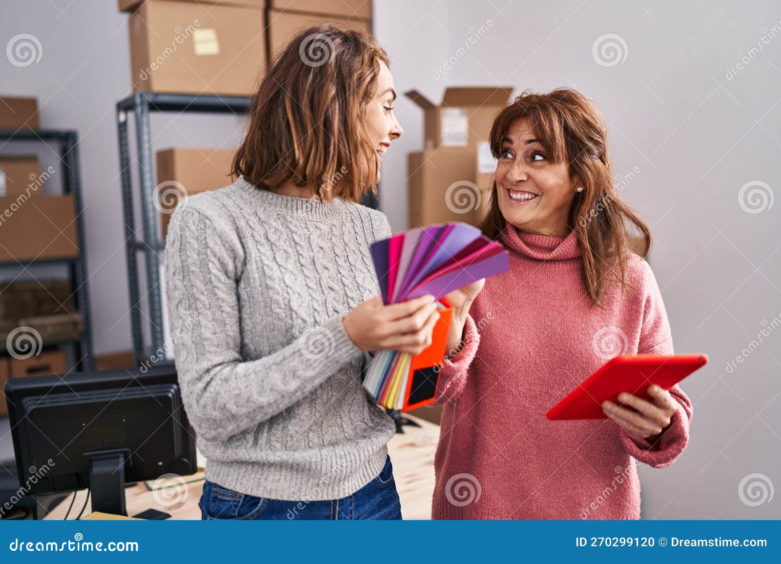 Two Women Ecommerce Business Workers Using Touchpad Choosing Color at ...