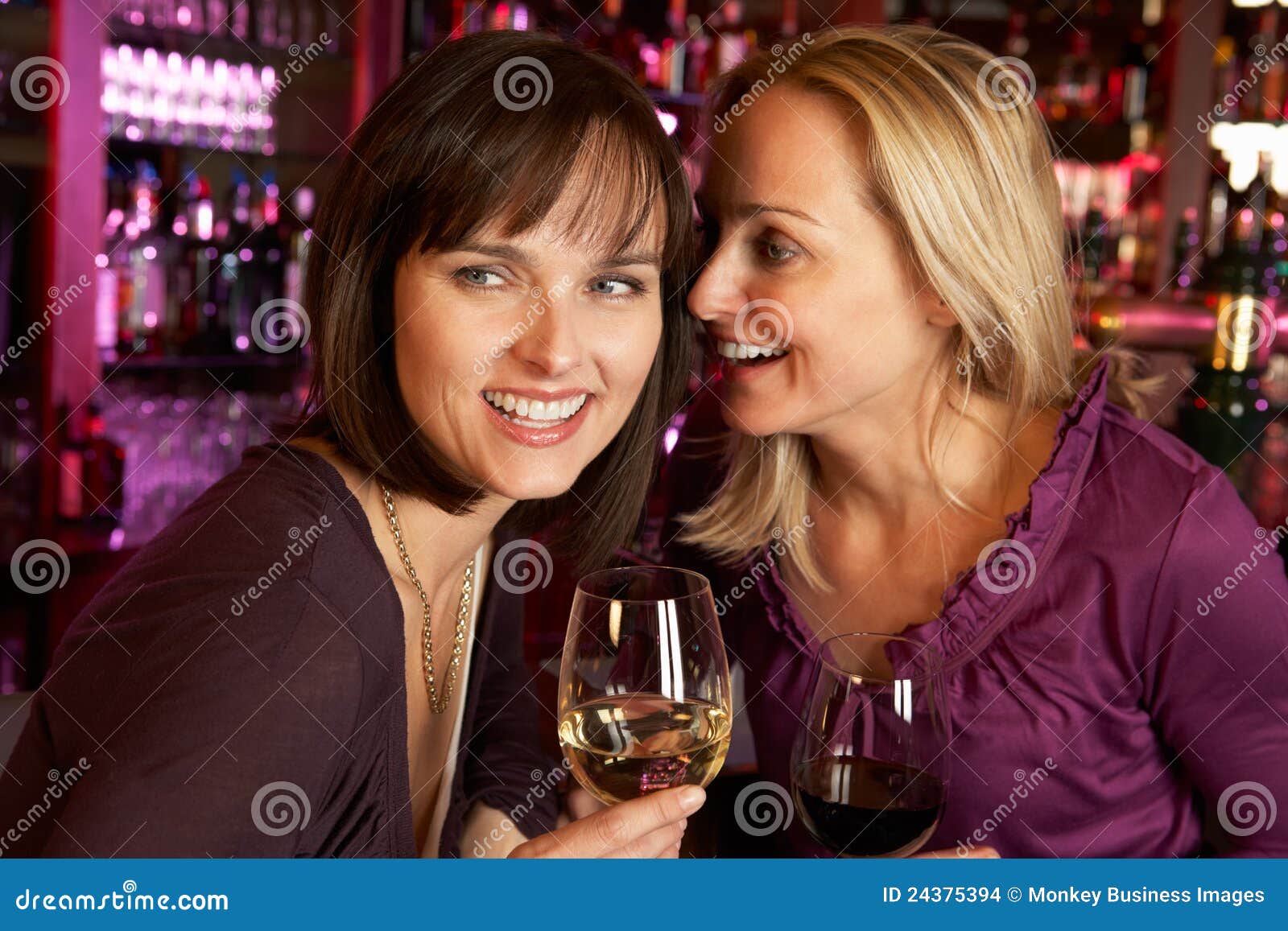 Two Women Enjoying Drink Together in Bar Stock Photo - Image of ...