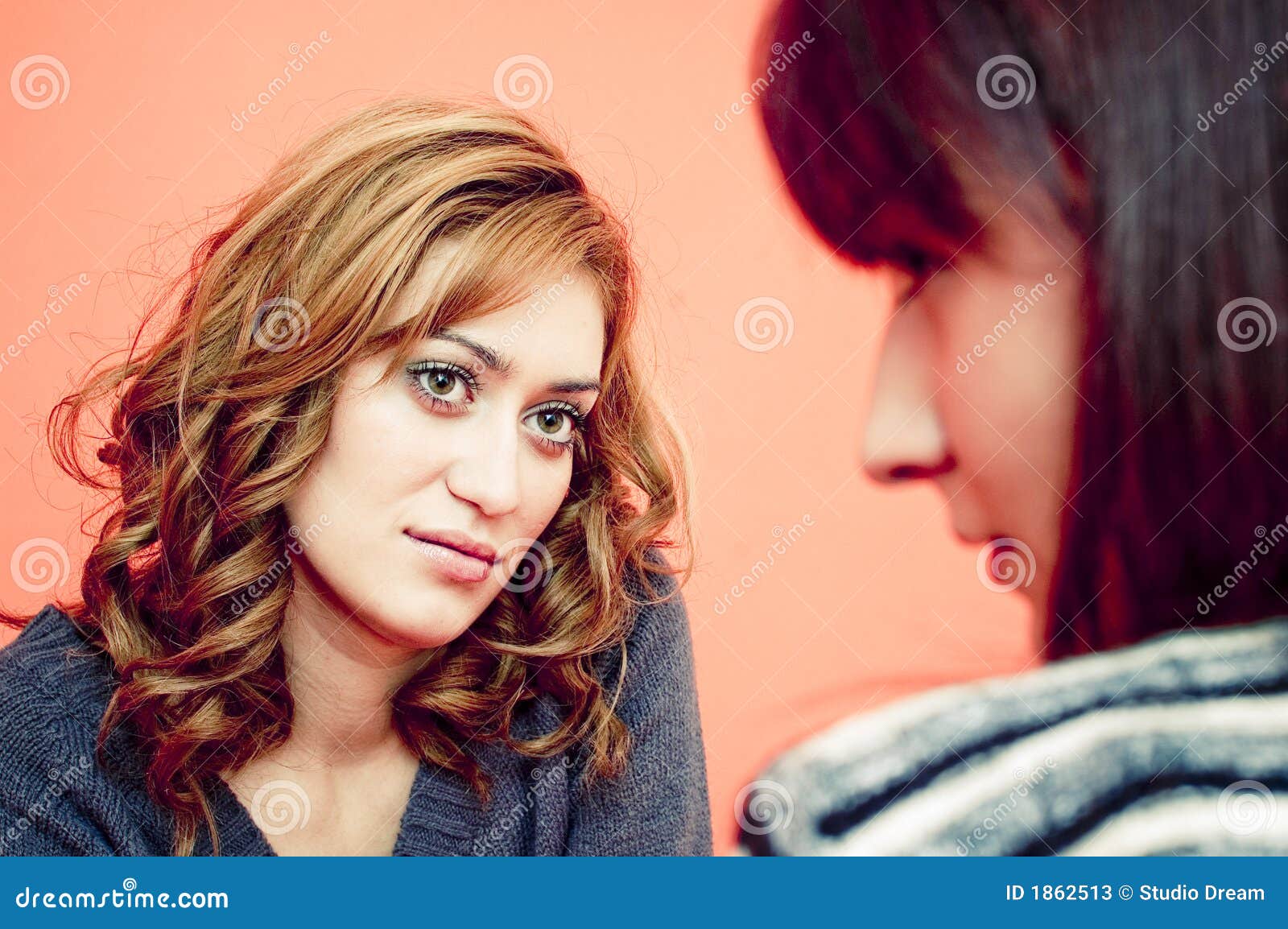 Two Women Facing One Another Stock Image - Image of outfit, contented ...
