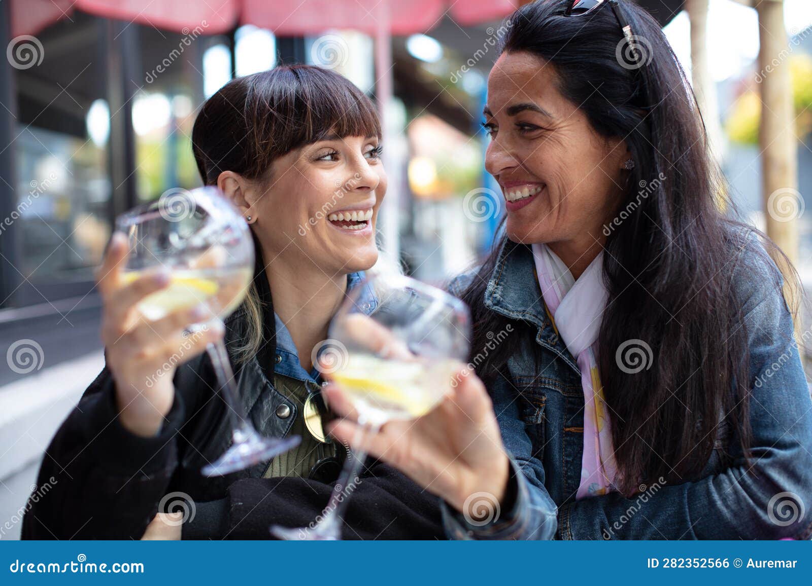 Two Women Friends Drinking Together Stock Photo - Image of girl, indoors: 282352566