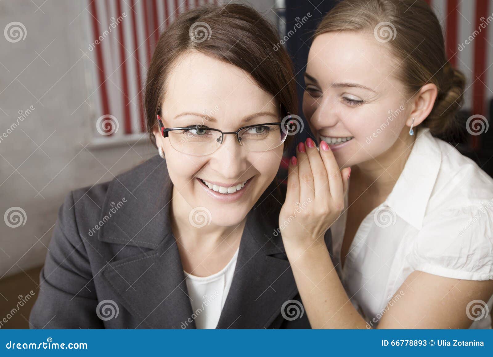Two women gossip at work stock image. Image of partnership - 66778893