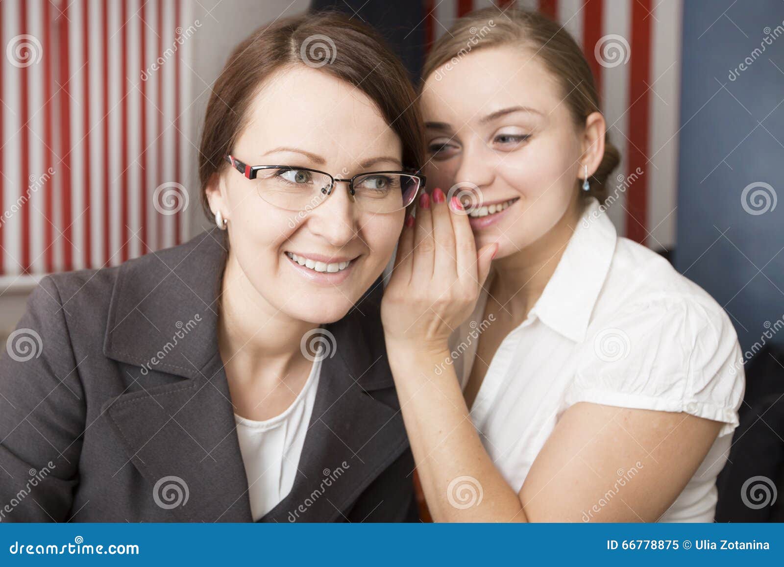 Two women gossip at work stock image. Image of partnership - 66778875