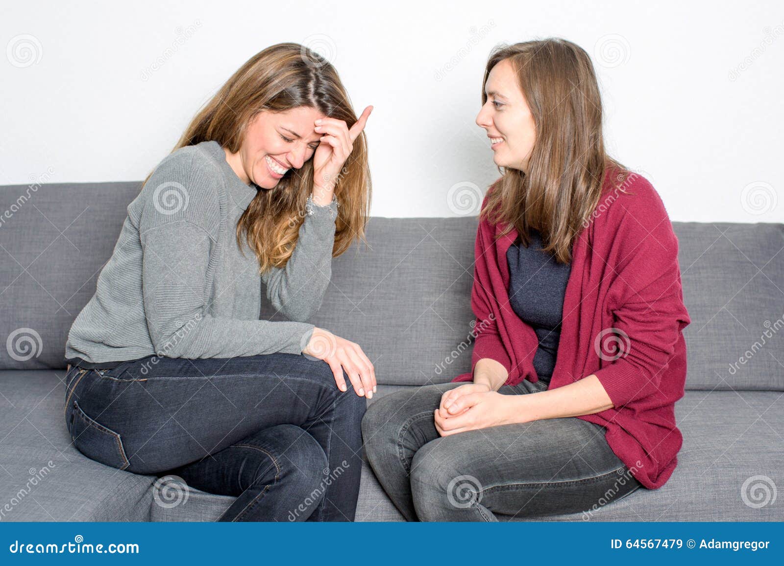 Two women having fun stock image. Image of room, talking - 64567479