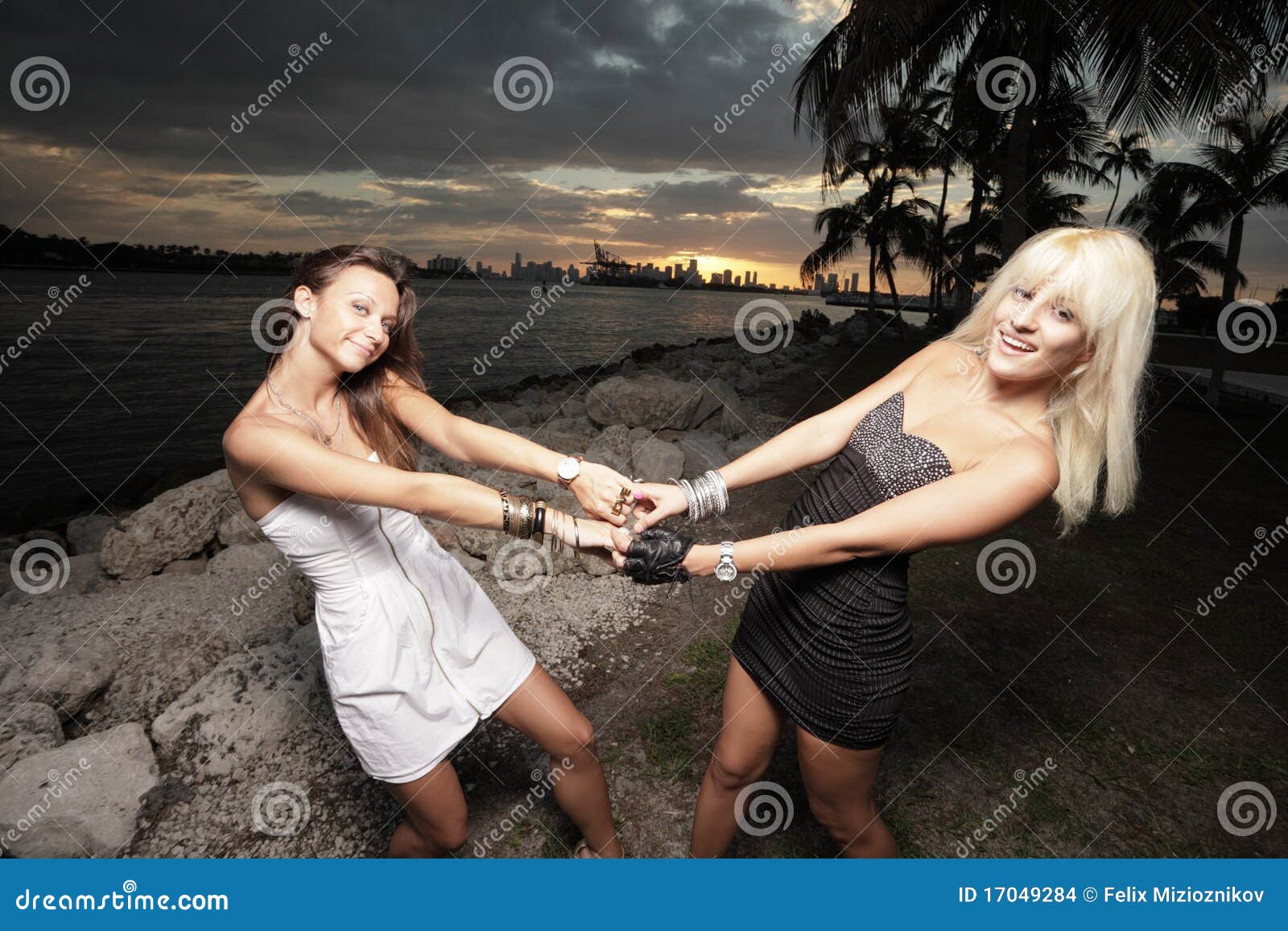 Two Women Holding Hands and Swinging Stock Photo - Image of couple ...