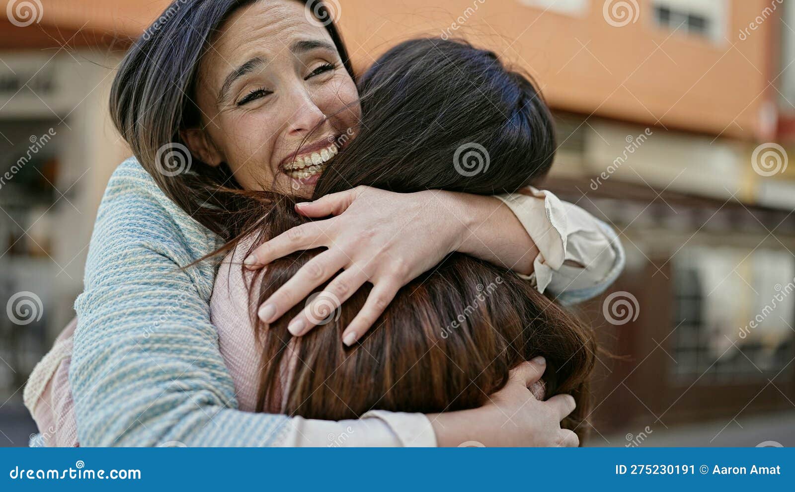 Two Women Hugging Each Other at Street Stock Image - Image of family ...