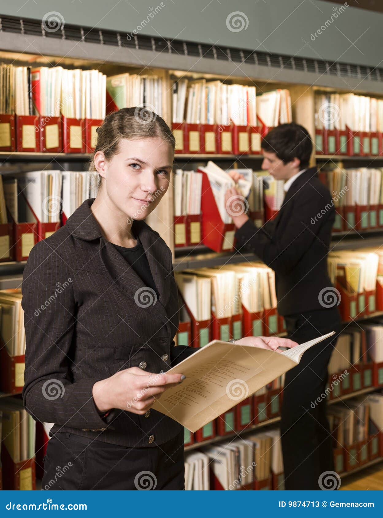 Two women at a library stock image. Image of desk, picking - 9874713