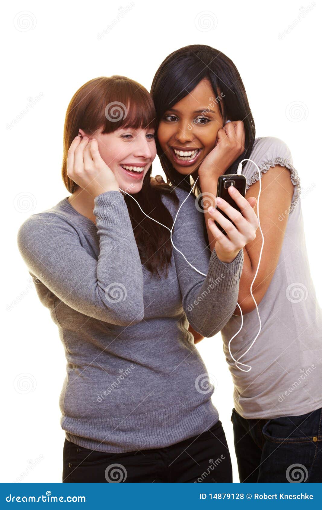 Two Women Listening To Cell Phone Stock Photo - Image of mobile, hobby ...