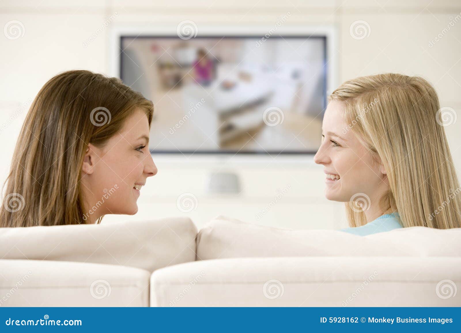 Two Women in Living Room Watching Television Stock Photo - Image of ...