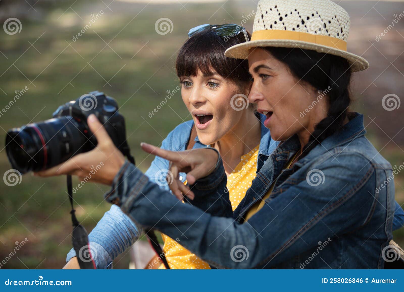Two Women Looking at Camera Screen during Sightseeing Stock Photo ...