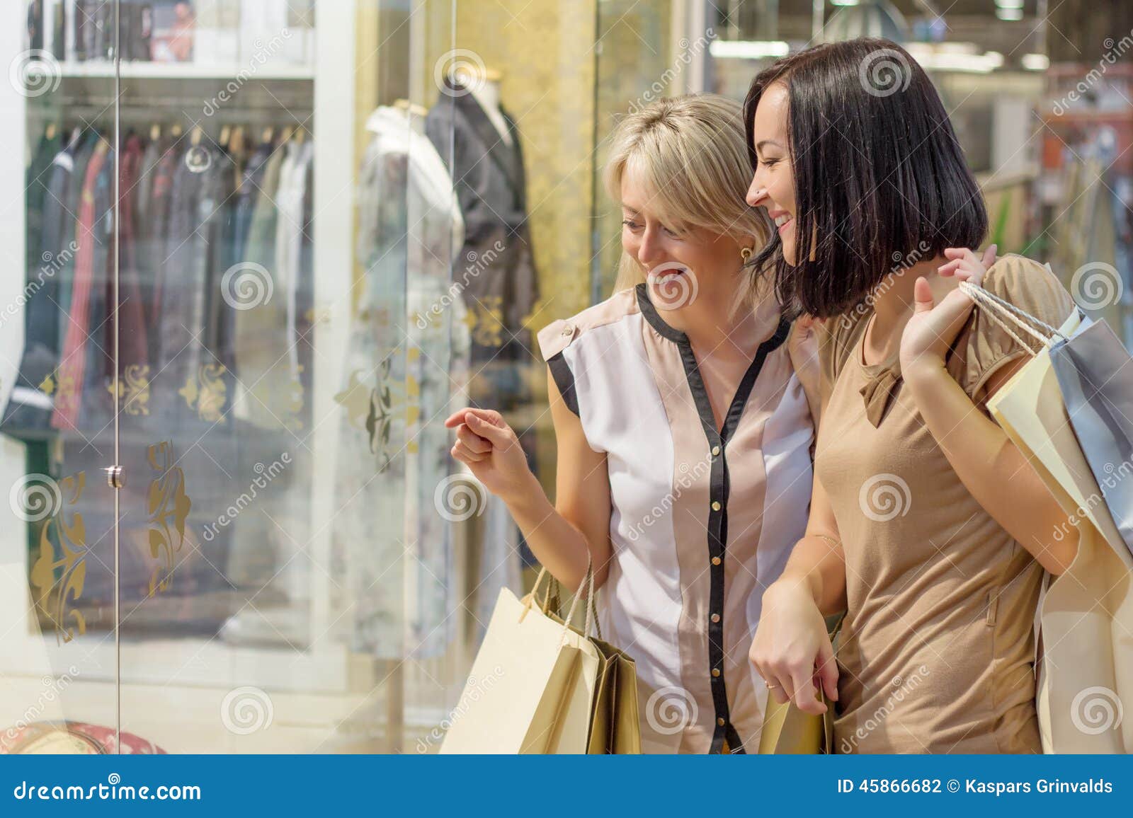 Two Women Looking through Shop Window Stock Photo - Image of adult ...