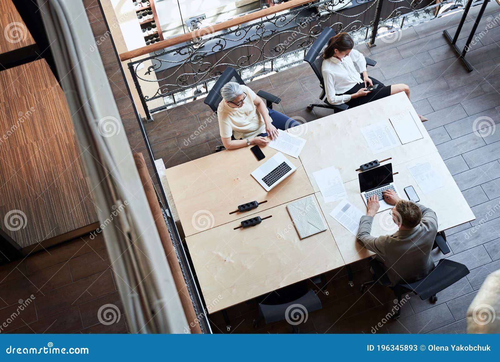 Two Women and a Man Sharing a Table at a Coworking Stock Image - Image ...