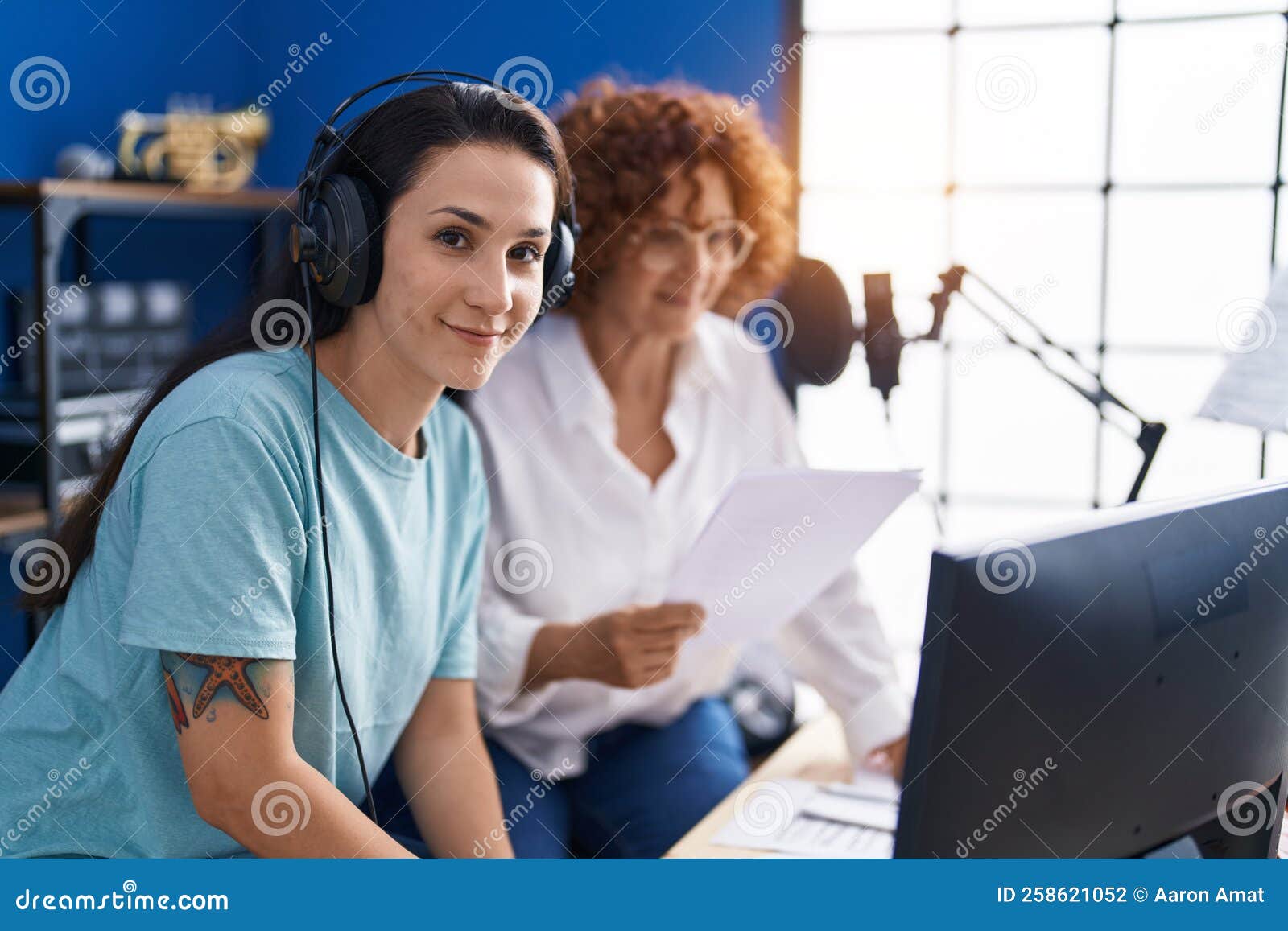 Two Women Musicians Composing Song Using Computer at Music Studio Stock ...