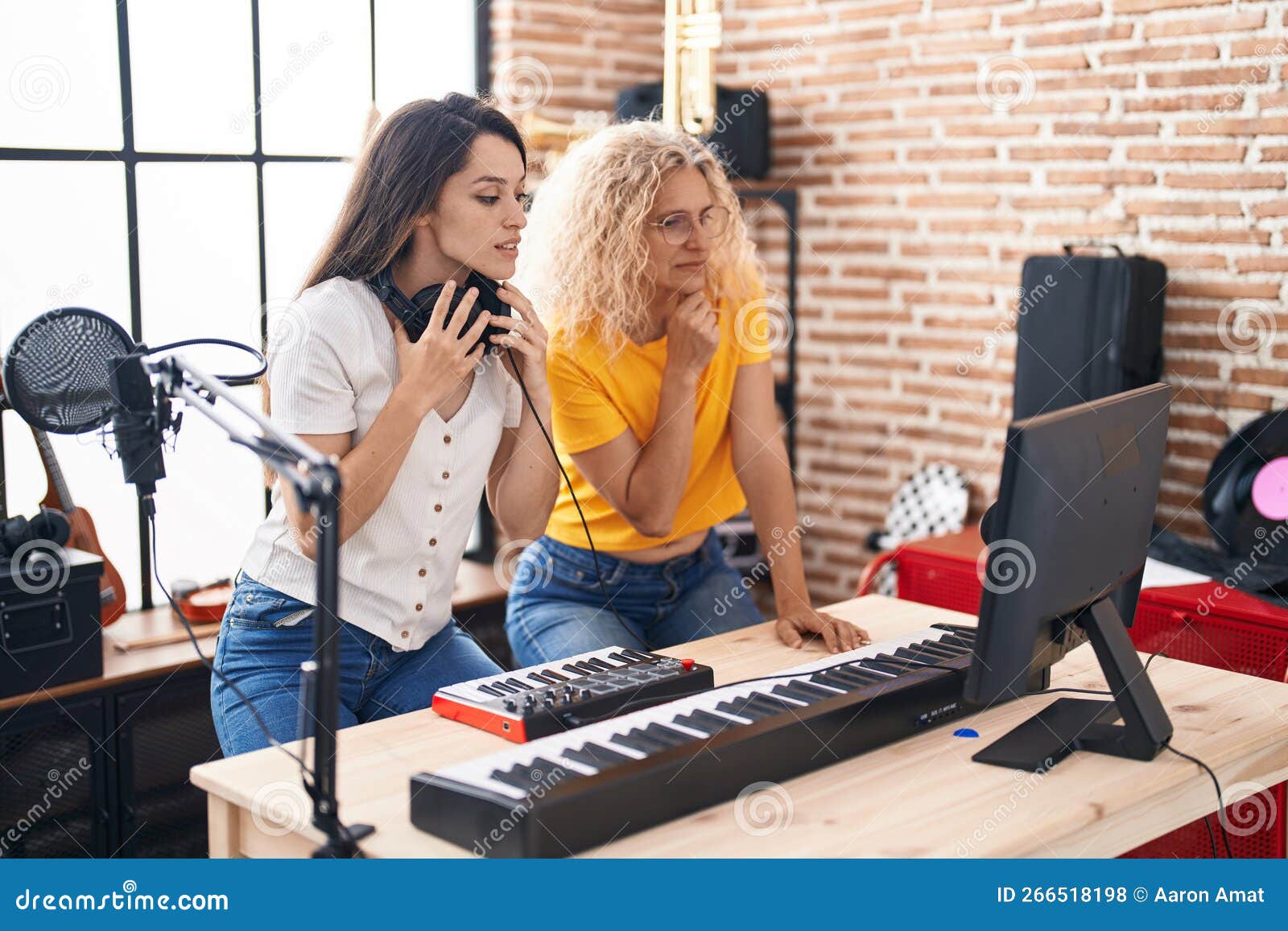 Two Women Musicians Composing Song Using Keyboard at Music Studio Stock ...