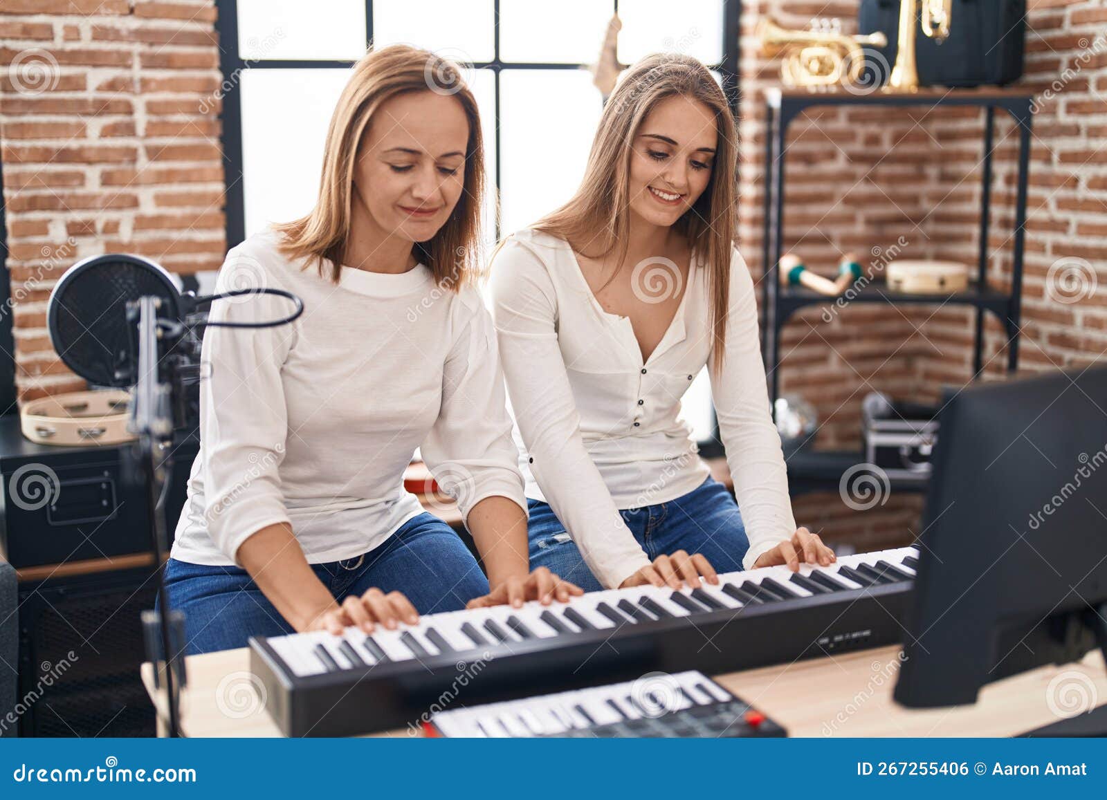 Two Women Musicians Playing Piano at Music Studio Stock Photo - Image ...