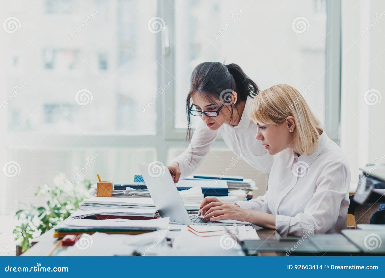 Two women in office stock photo. Image of adult, computer - 92663414
