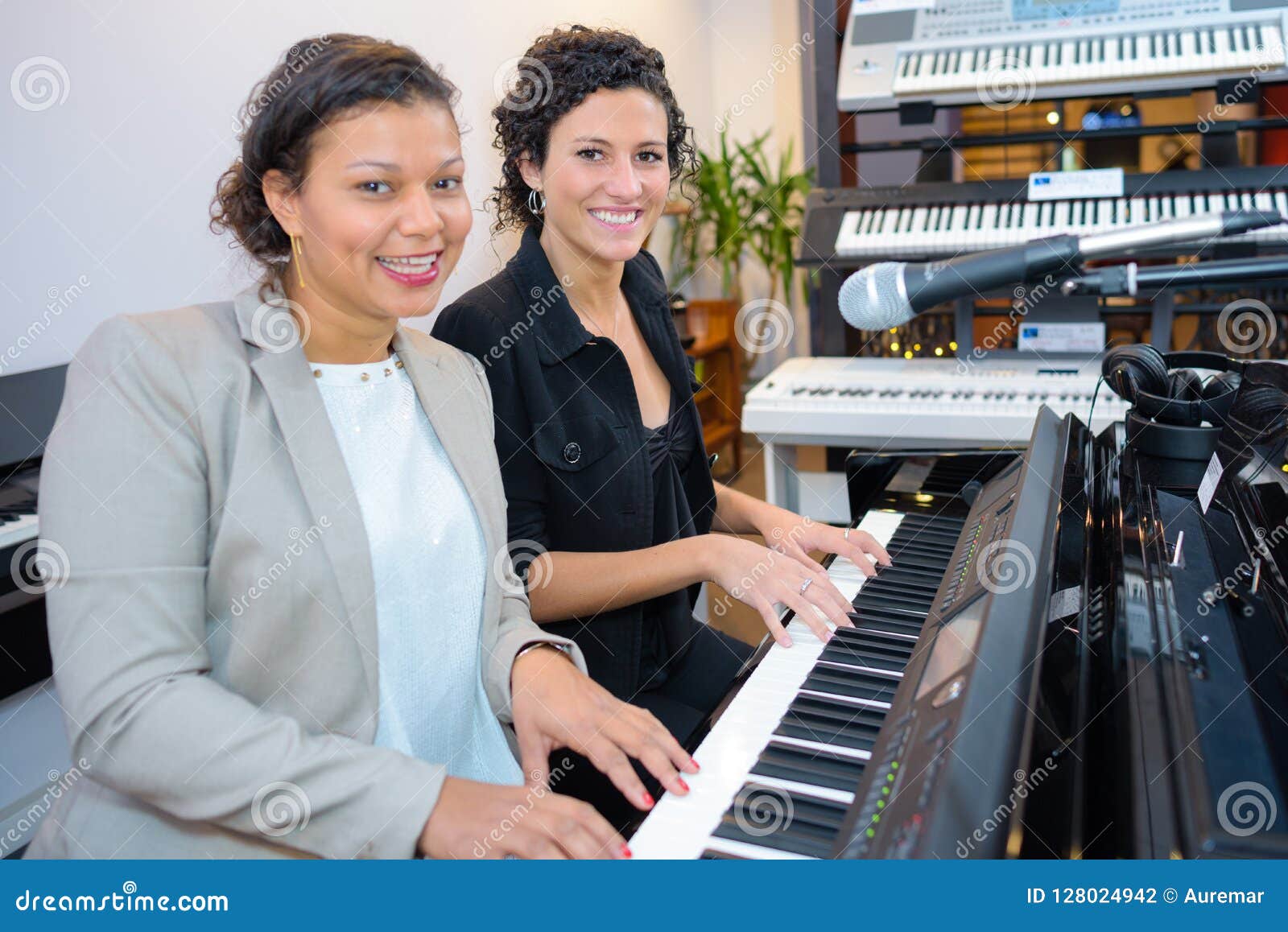 Two Women at Organ Keyboard Stock Photo - Image of notes, smile: 128024942