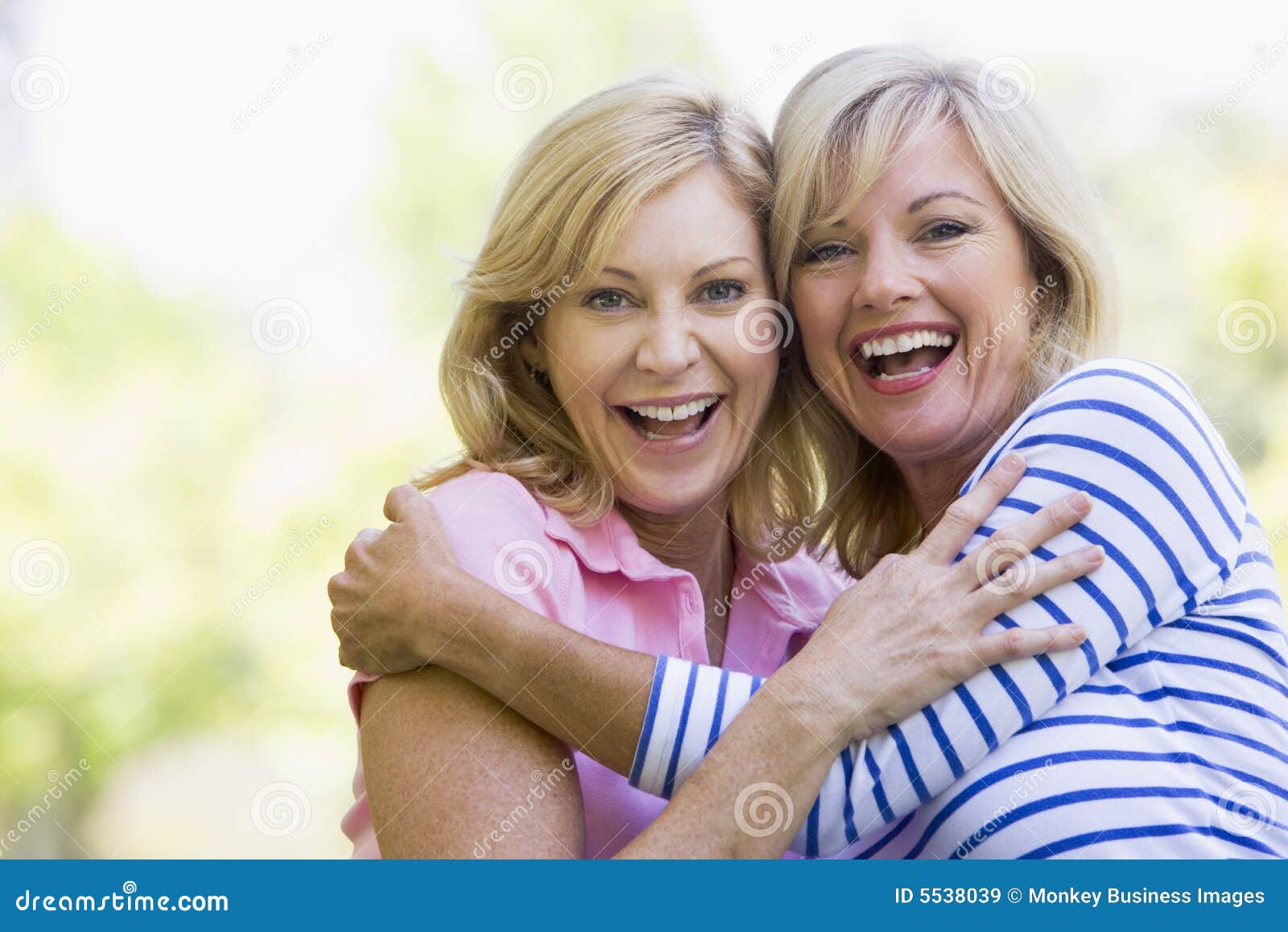 Two Women Outdoors Hugging and Smiling Stock Image - Image of lifestyle ...