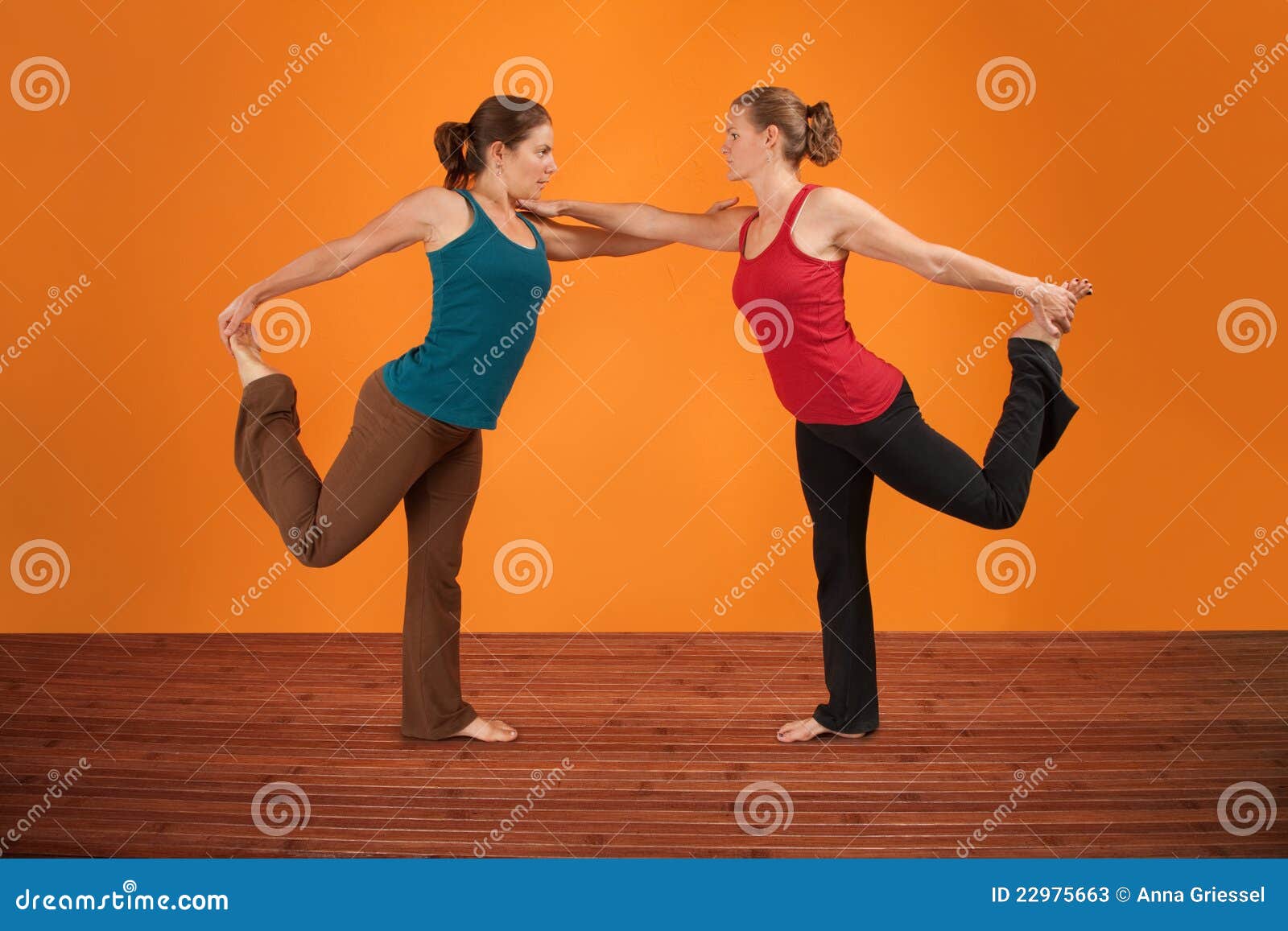 Two Women Perform Yoga stock image. Image of balance - 22975663