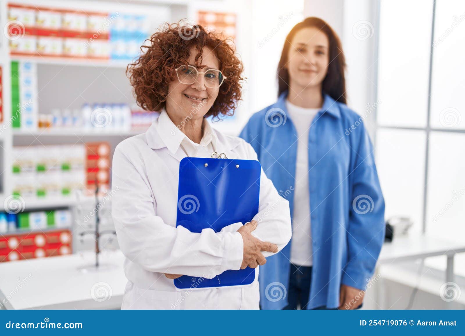 Two Women Pharmacist and Customer Smiling Confident Standing at ...