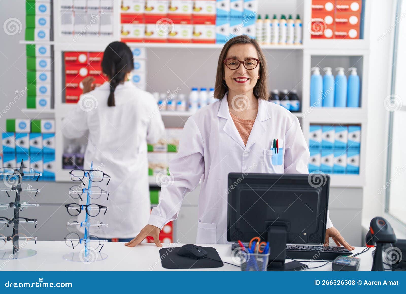 Two Women Pharmacist Using Computer Working at Pharmacy Stock Photo ...